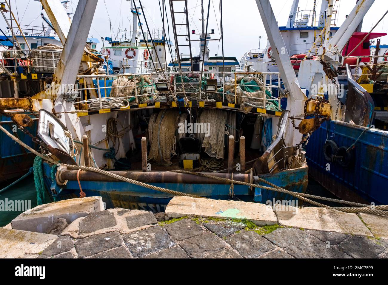 Details of colorful fishing boats, anchored in the harbour of Marsala ...