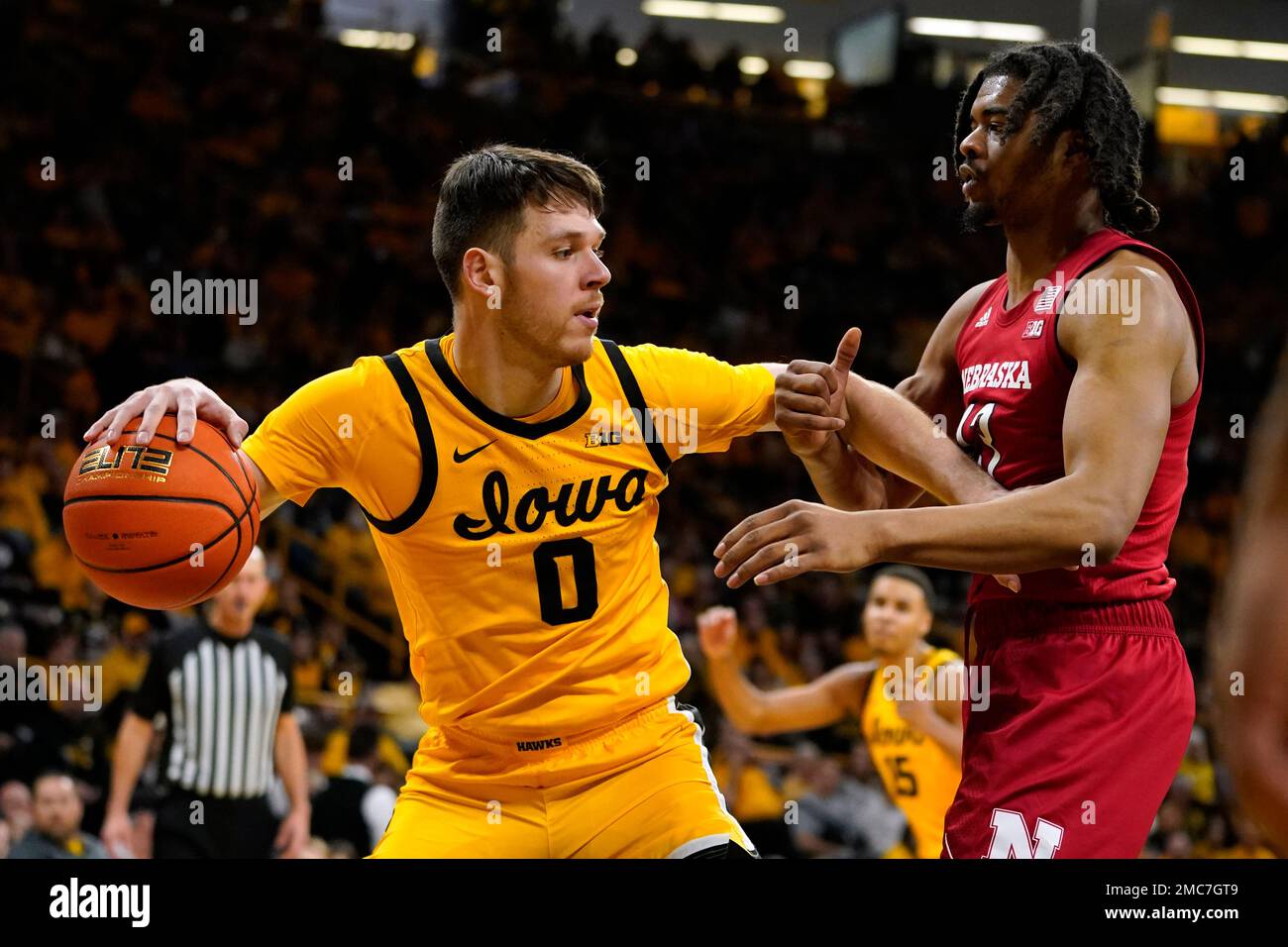 Iowa forward Filip Rebraca (0) drives around Nebraska forward Derrick ...
