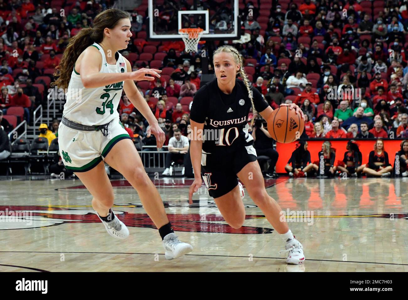 Louisville guard Hailey Van Lith (10) drives around Notre Dame forward ...