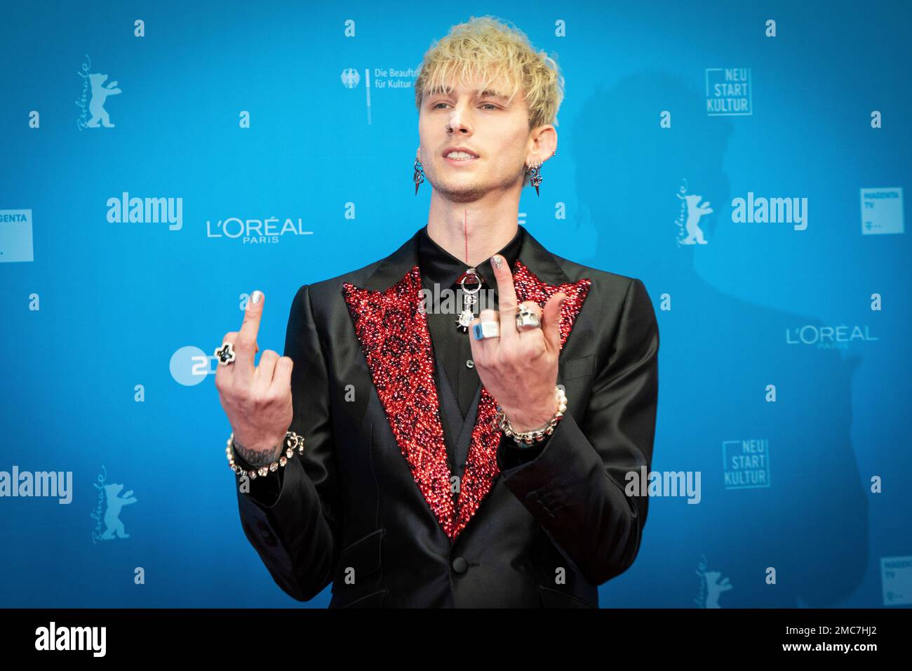 Colson Baker, also known as Machine Gun Kelly, poses for photographers ...
