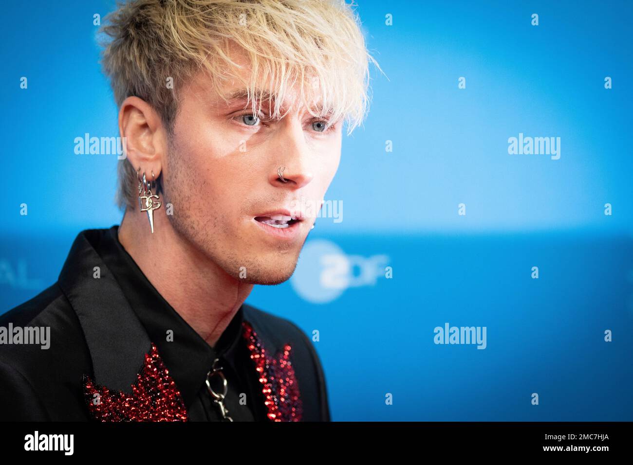 Colson Baker, also known as Machine Gun Kelly, poses for photographers ...