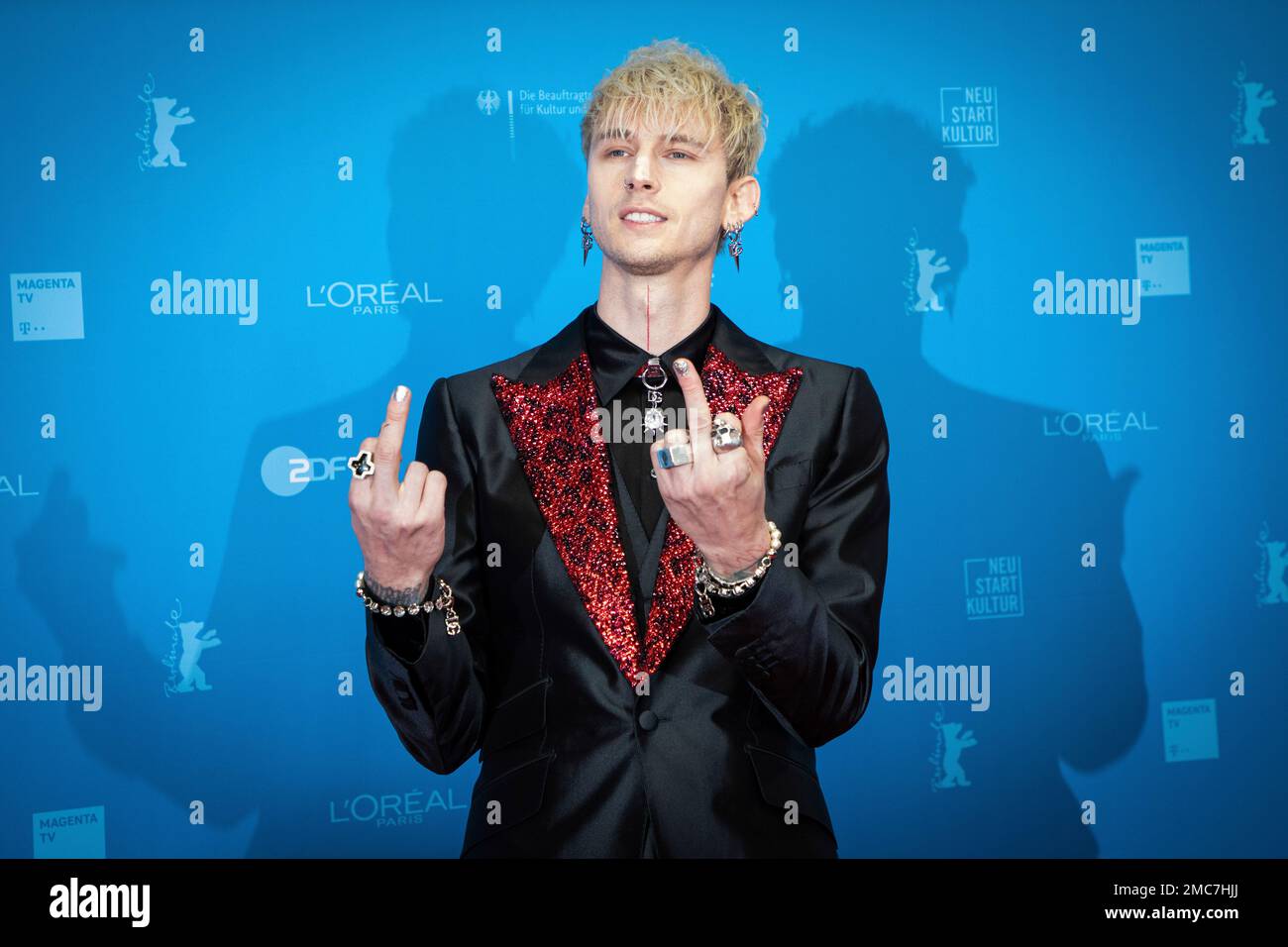 Colson Baker, also known as Machine Gun Kelly, poses for photographers ...