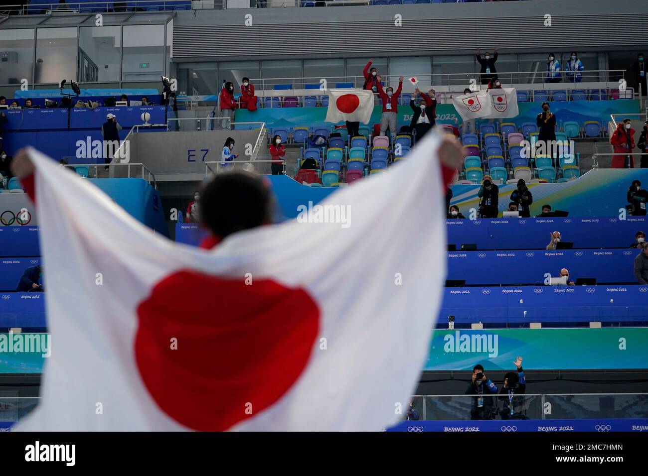 Miho Takagi of Japan holds her country's flag after winning the silver ...