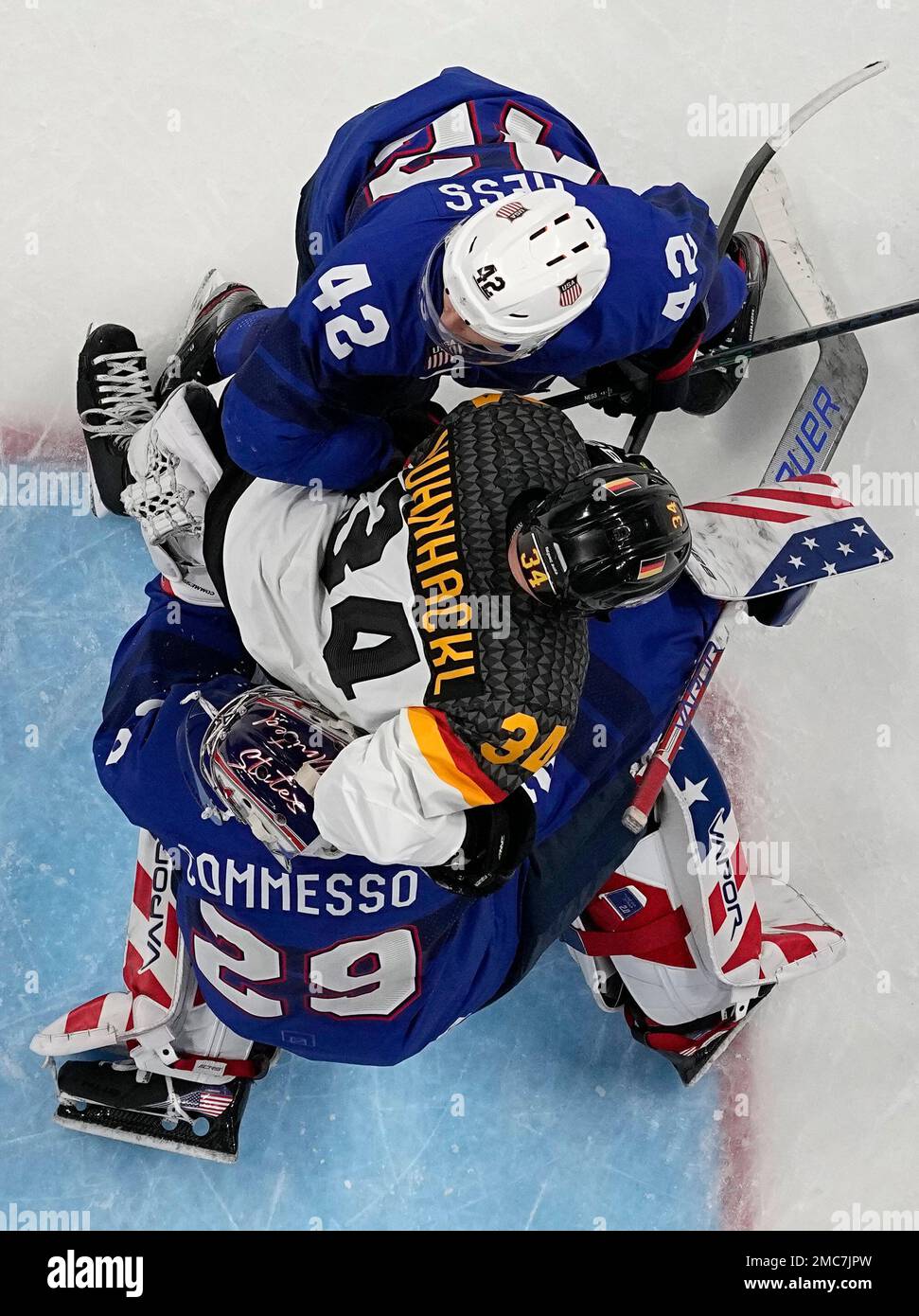Germany's Yasin Ehli, center, collides with United States goalkeeper ...
