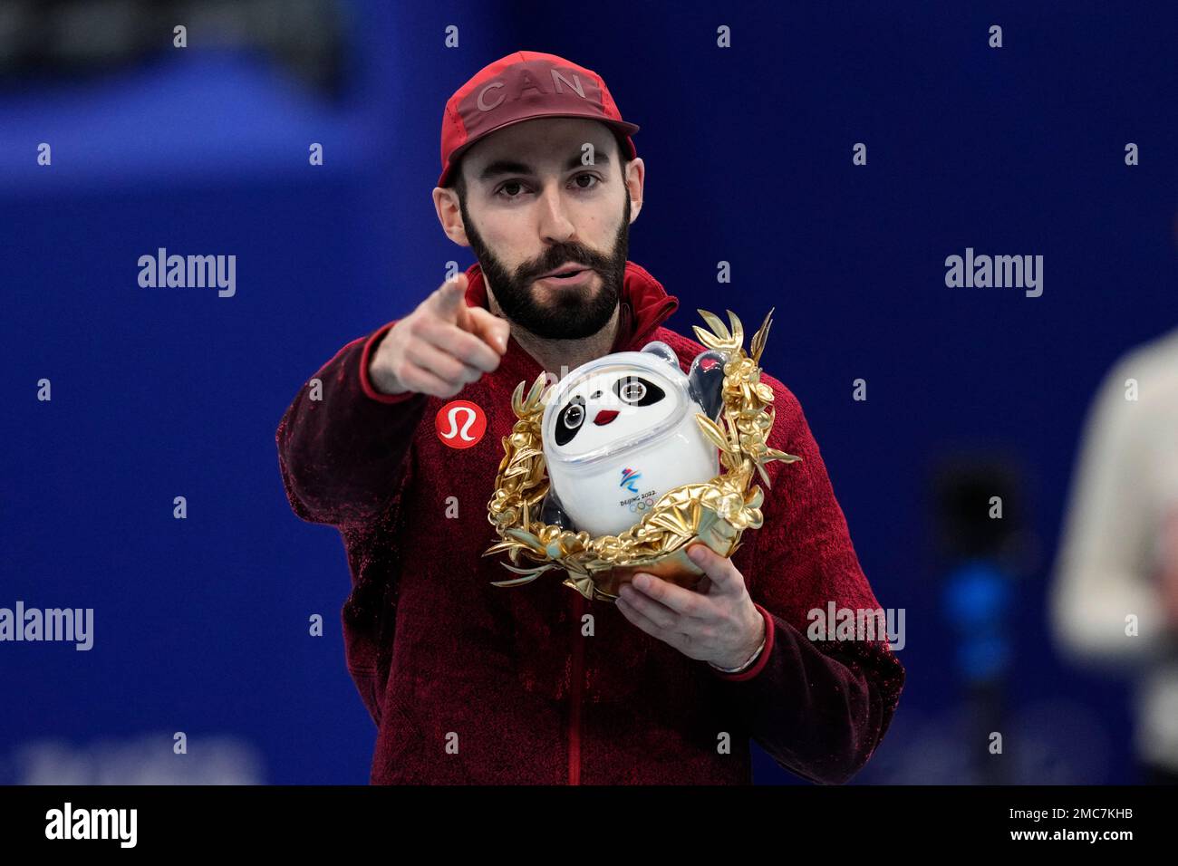 Bronze medalist Steven Dubois of Canada, reacts on the podium during ...