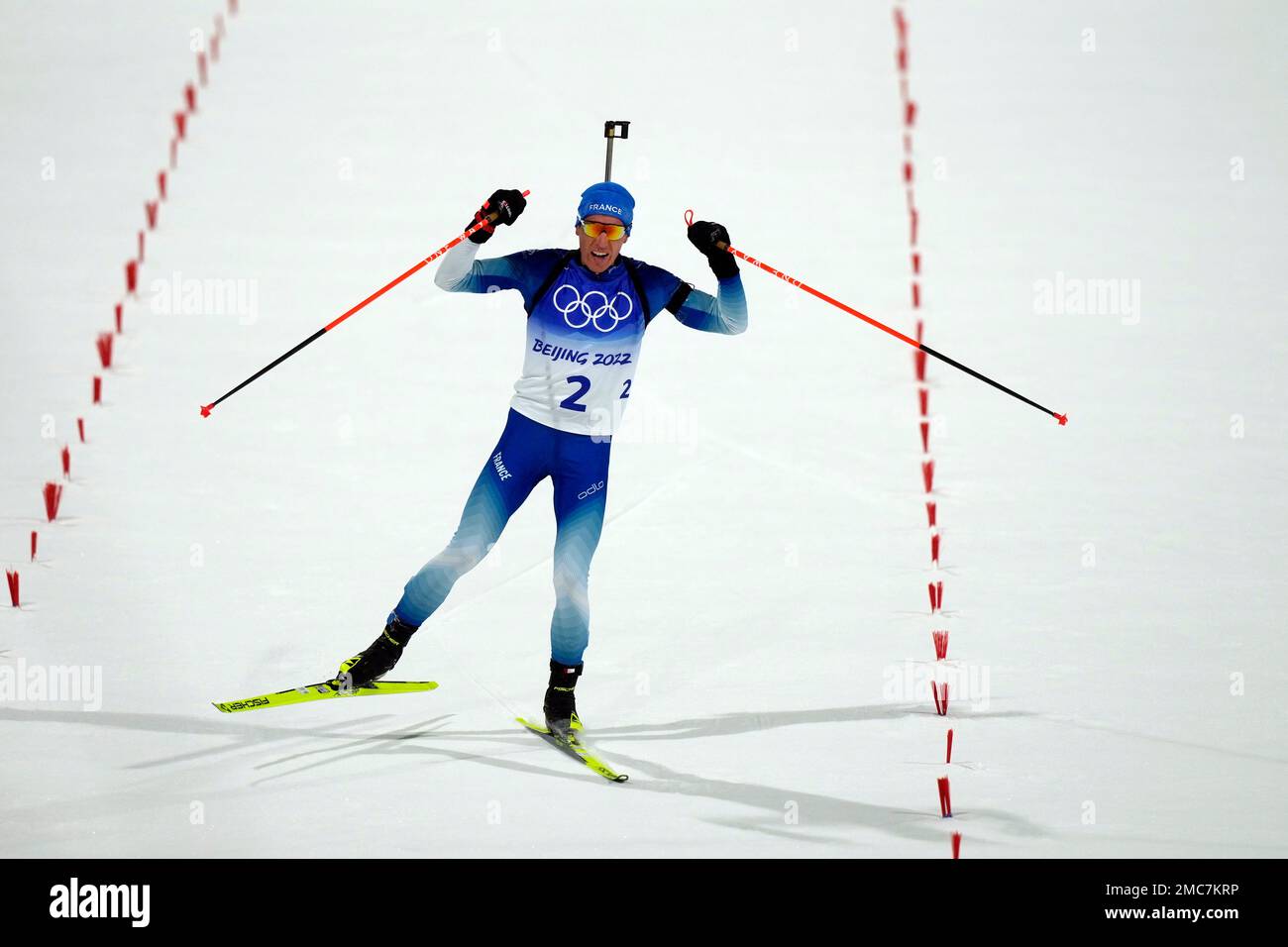 Quentin Fillon Maillet of France crosses the finish line in first ...