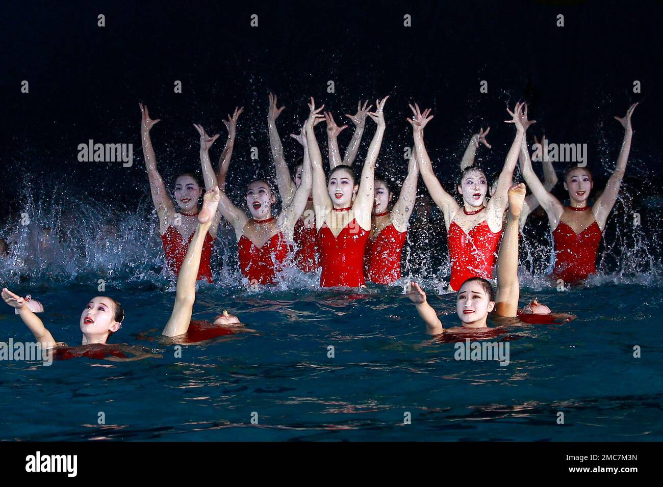 A group of synchronized swimmers perform celebrating the Day of Shining ...