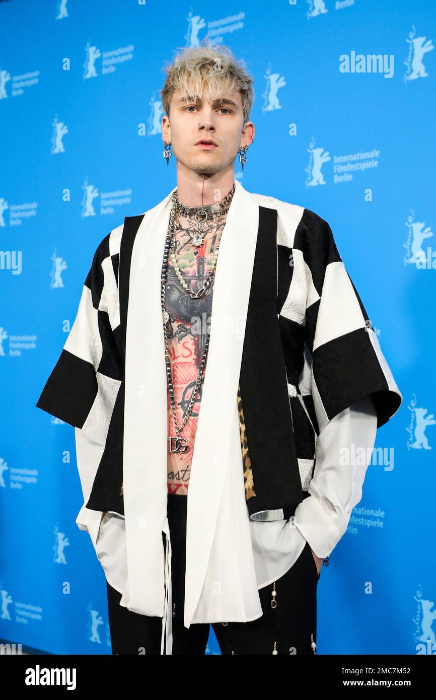 Colson Baker, also known as Machine Gun Kelly, poses for photographers ...