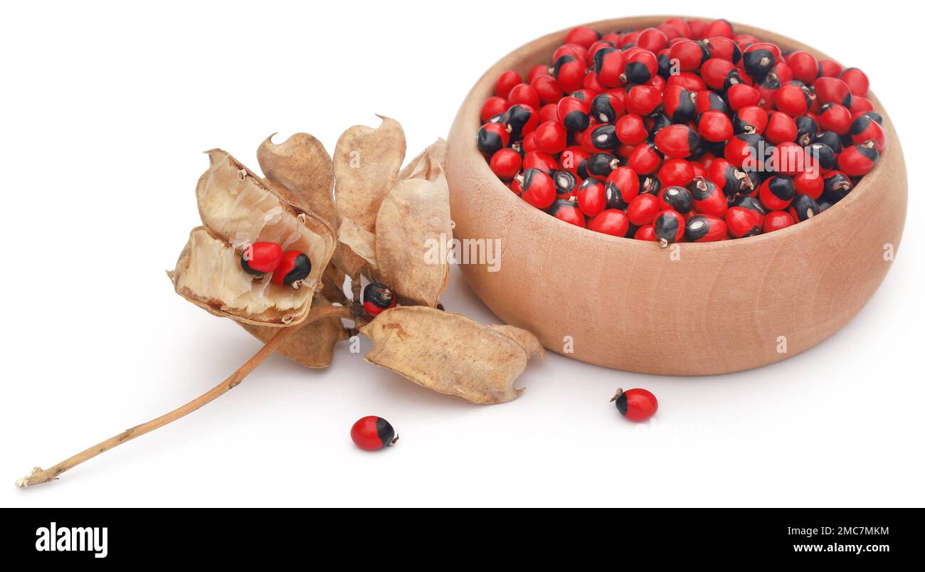 Abrus precatorius or Indian liquorice Seeds over white background Stock ...