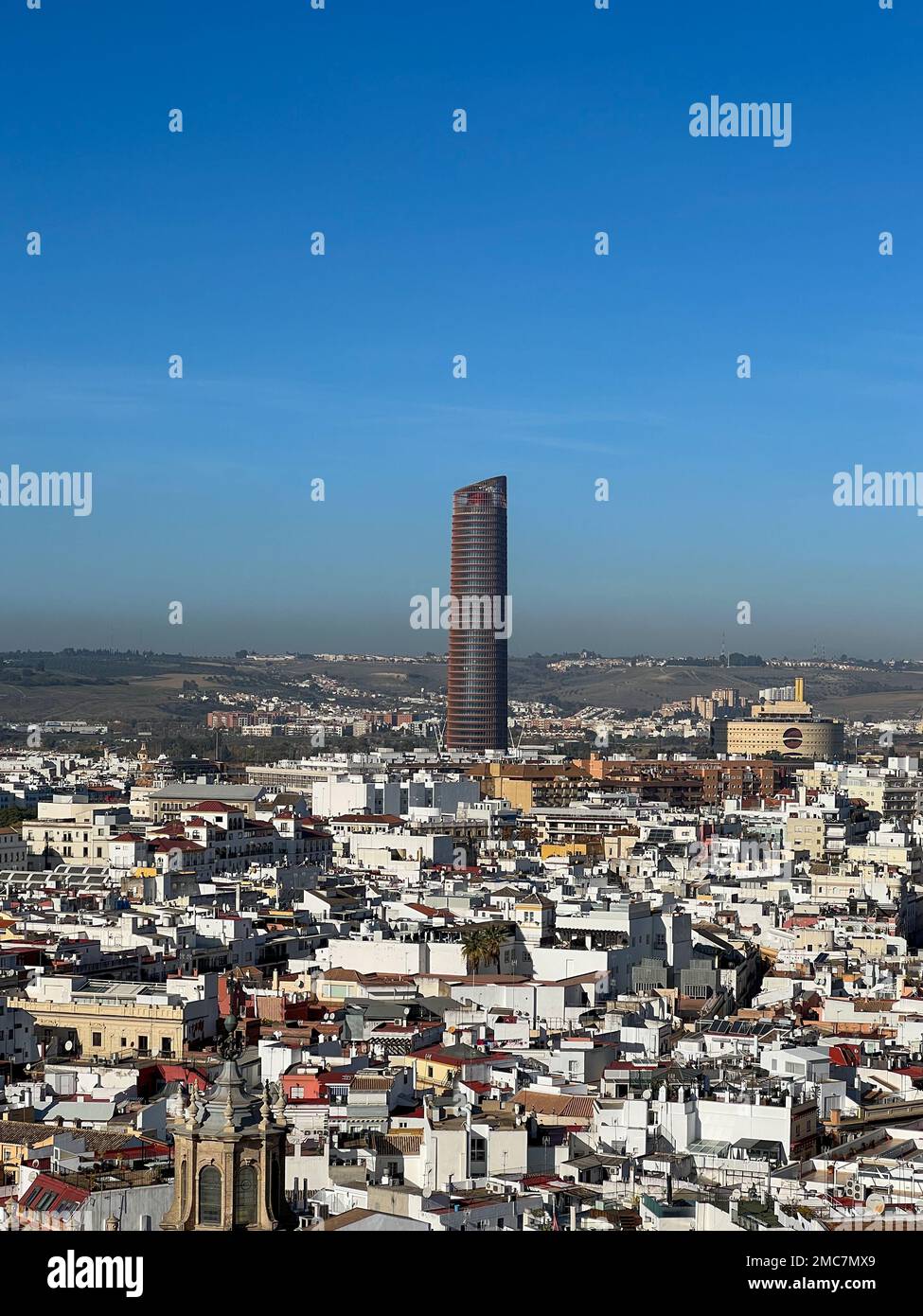 Aerial view of Sevilla Tower (Spanish: Torre Sevilla) at sunrise ...