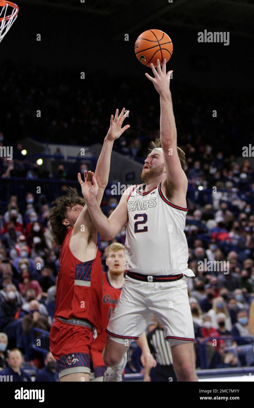 Gonzaga forward Drew Timme, right, shoots over Saint Mary's forward ...