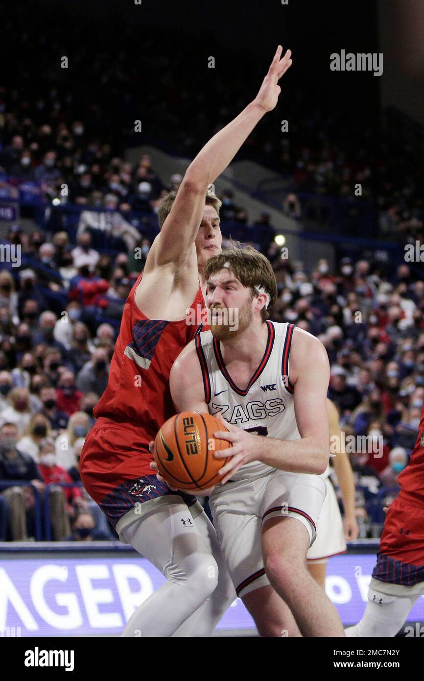 Gonzaga forward Drew Timme, right, drives to the basket as Saint Mary's ...