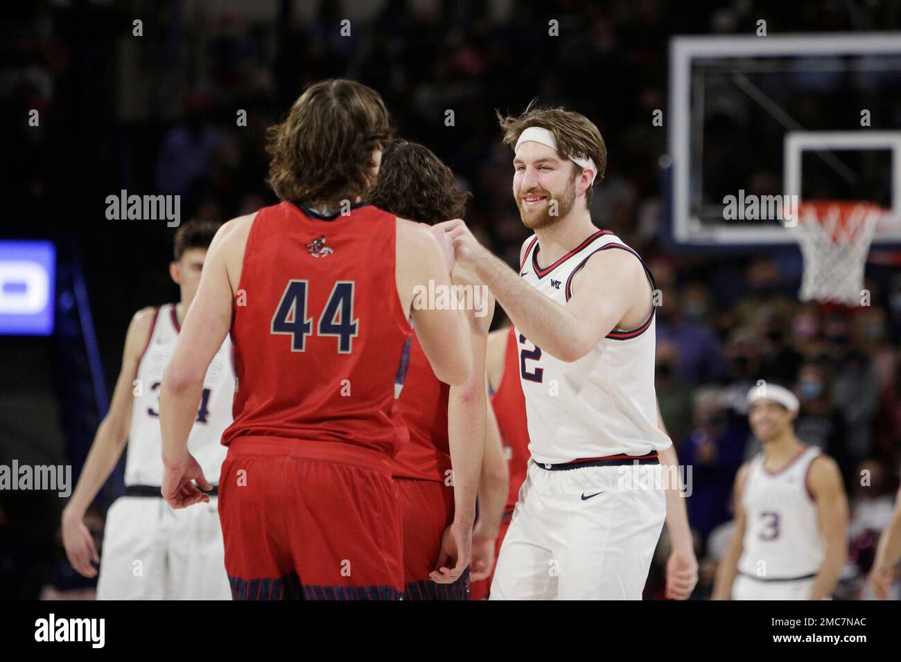 Gonzaga forward Drew Timme, right, greets Saint Mary's guard Alex Ducas ...
