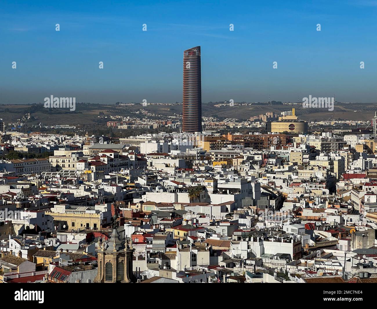 Aerial view of Sevilla Tower (Spanish: Torre Sevilla) at sunrise ...