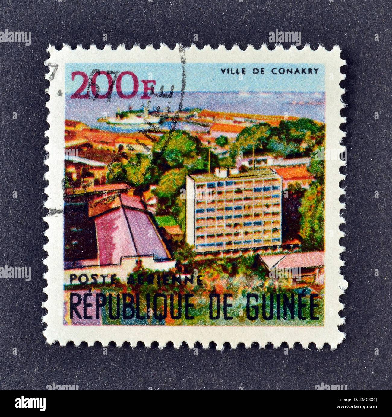 Cancelled postage stamp printed by Guinea, that shows Ville De Conakry ...