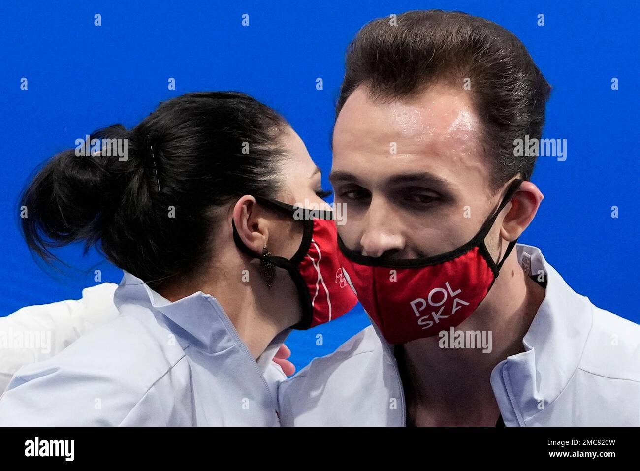 Natalia Kaliszek and Maksym Spodyriev, of Poland, react after their ...