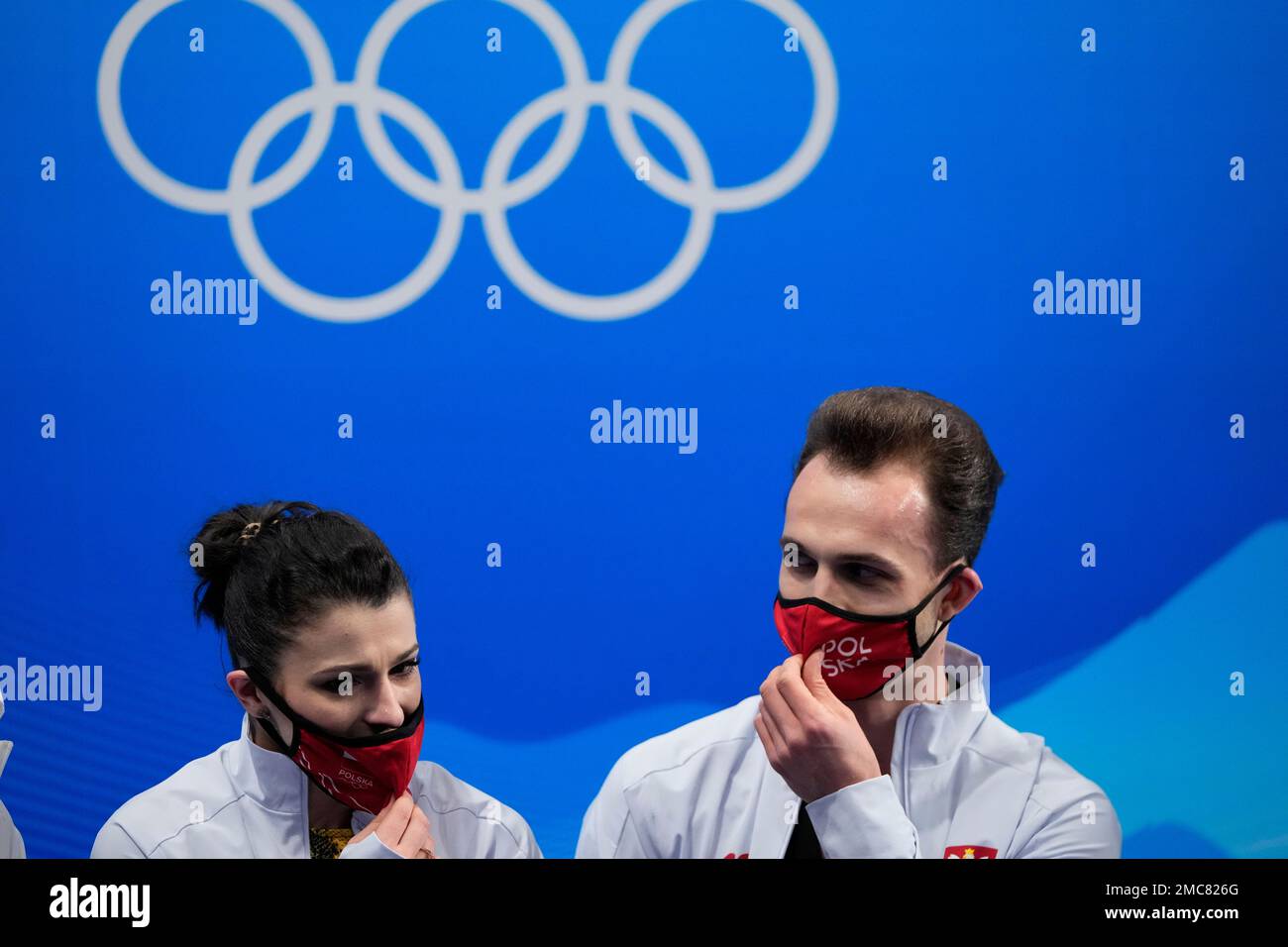 Natalia Kaliszek and Maksym Spodyriev, of Poland, react after their ...