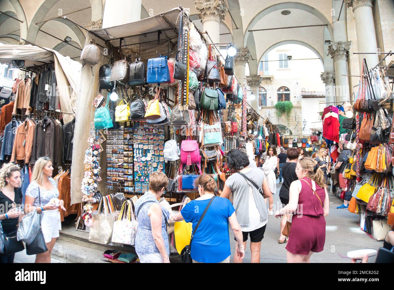 Shoppers busy in a market in Florence, Italy Stock Photo - Alamy