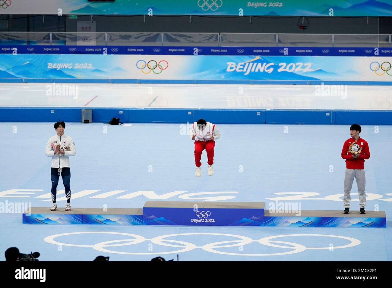 Gold medalist Gao Tingyu of China, center, celebrates during a venue ...