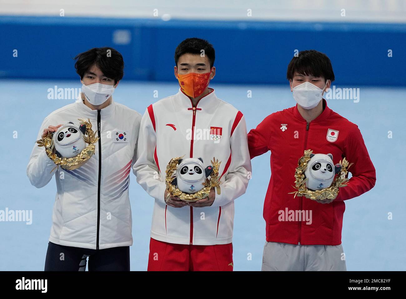 Gao Tingyu of China poses during a medal ceremony after winning the ...