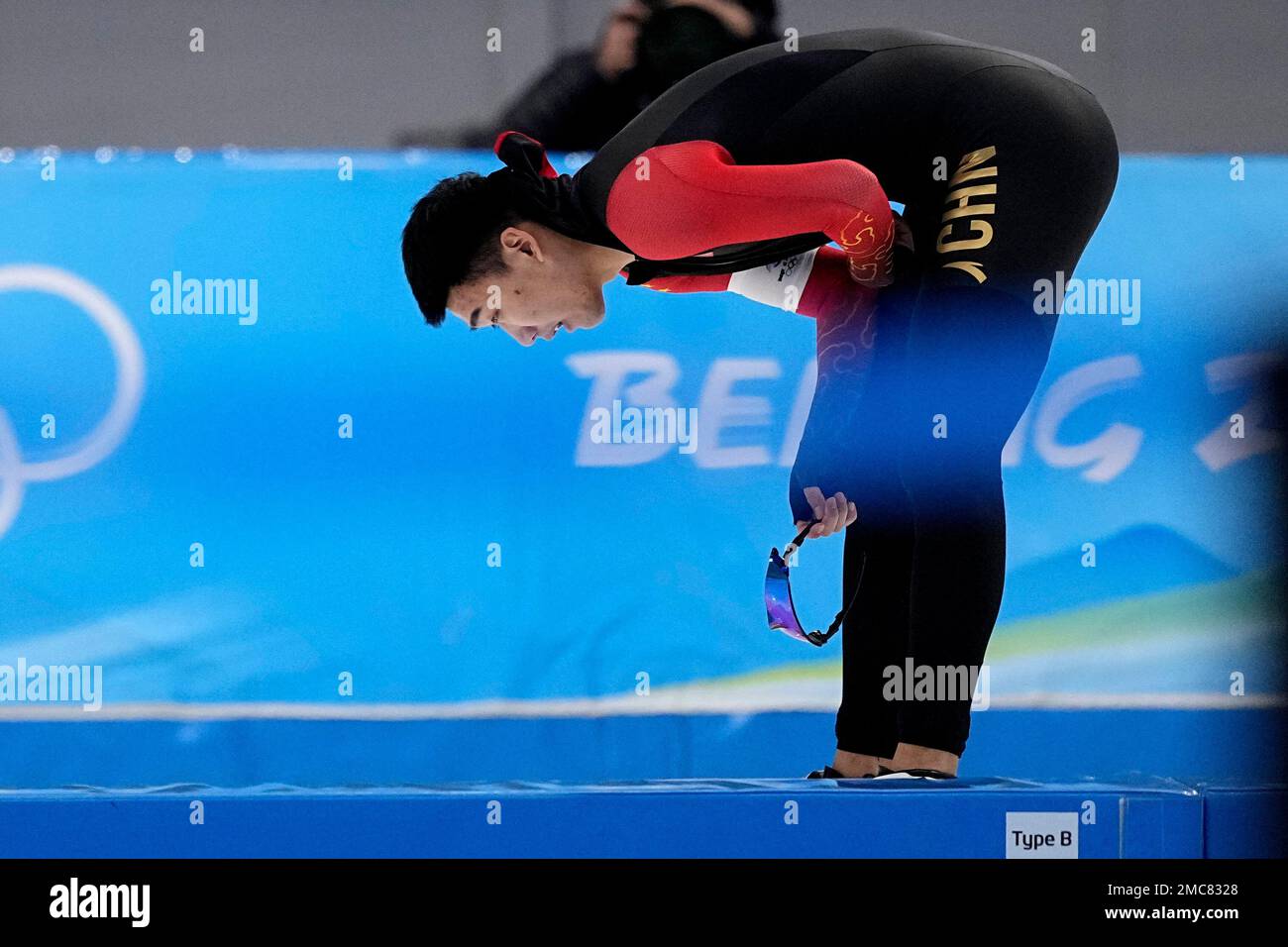 Gao Tingyu of China reacts after setting an Olympic record in the men's ...