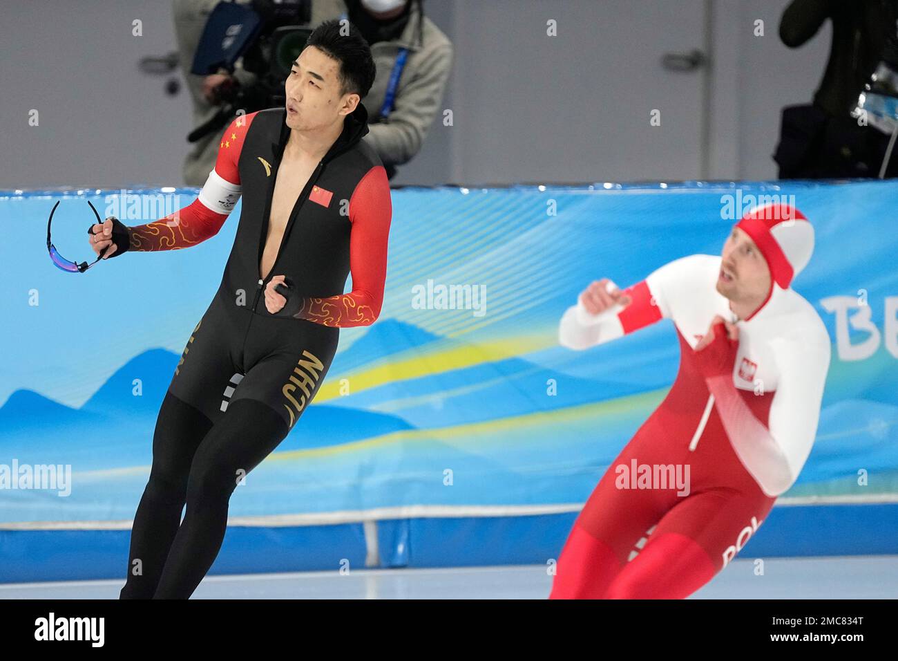 Gao Tingyu of China reacts after setting an Olympic record during his ...