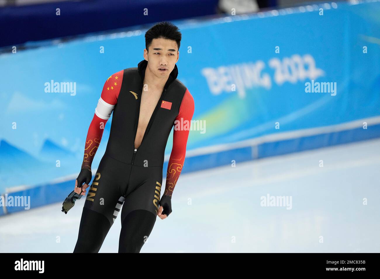 Gao Tingyu of China reacts after setting an Olympic record during the ...
