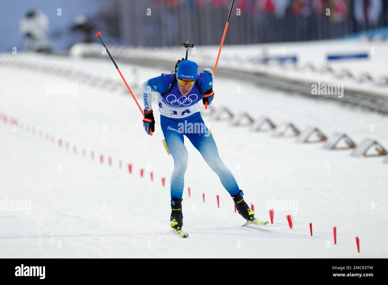 Quentin Fillon Maillet of France crosses the finish line during the men ...
