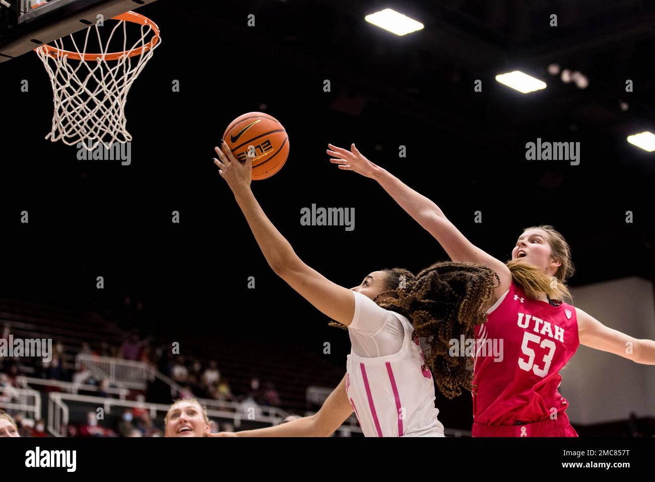 Stanford guard Haley Jones, left, shoots as Utah forward Kelsey Rees ...