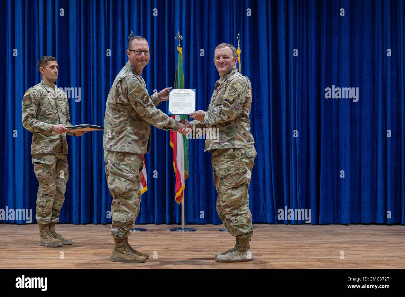 U.S. Air Force Col. Clinton Wilson, center, commander of the 386th Air ...