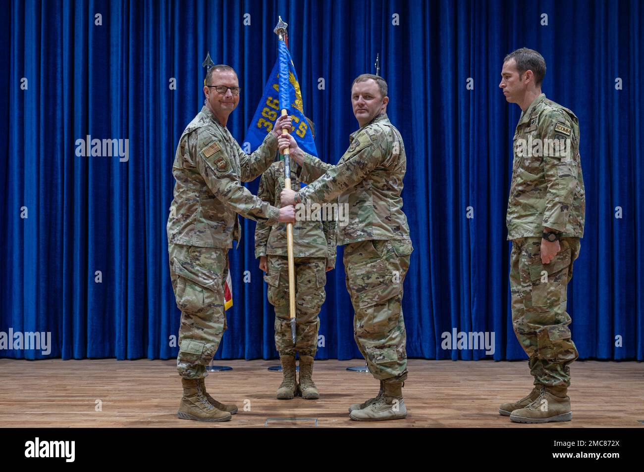U.S. Air Force Lt. Col. Nicholas Gronlund, center, the outgoing ...