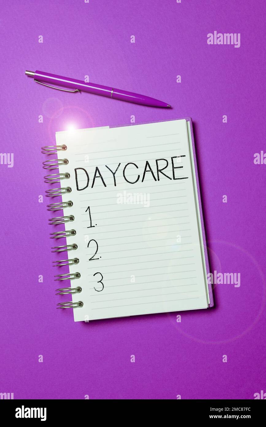 Hand writing sign Daycare. Word Written on offering care to preschool ...