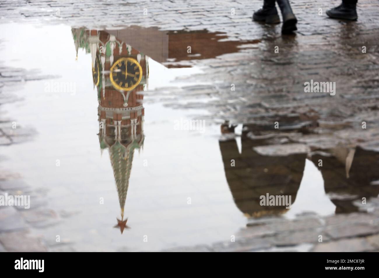 Moscow Red square during rainy weather. Reflection of Kremlin tower and ...