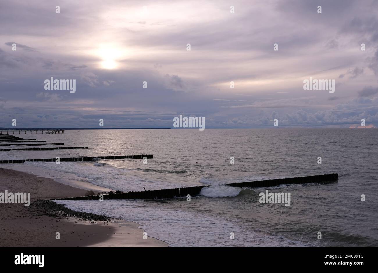 Beautiful calm landscape on the sea with early sunset beginning with ...