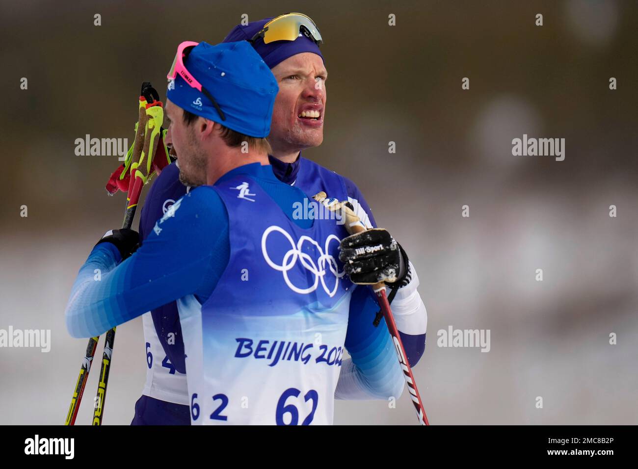 Iivo Niskanen, of Finland, (64) and Hugo Lapalus, of France, embrace ...