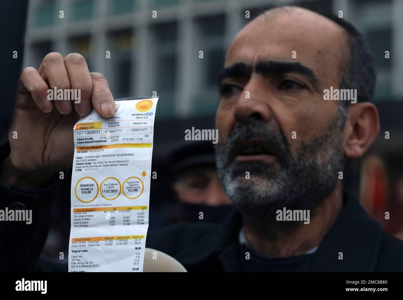 Kazim Iscen, a painter and decorator shows his bill in Ankara, Turkey ...