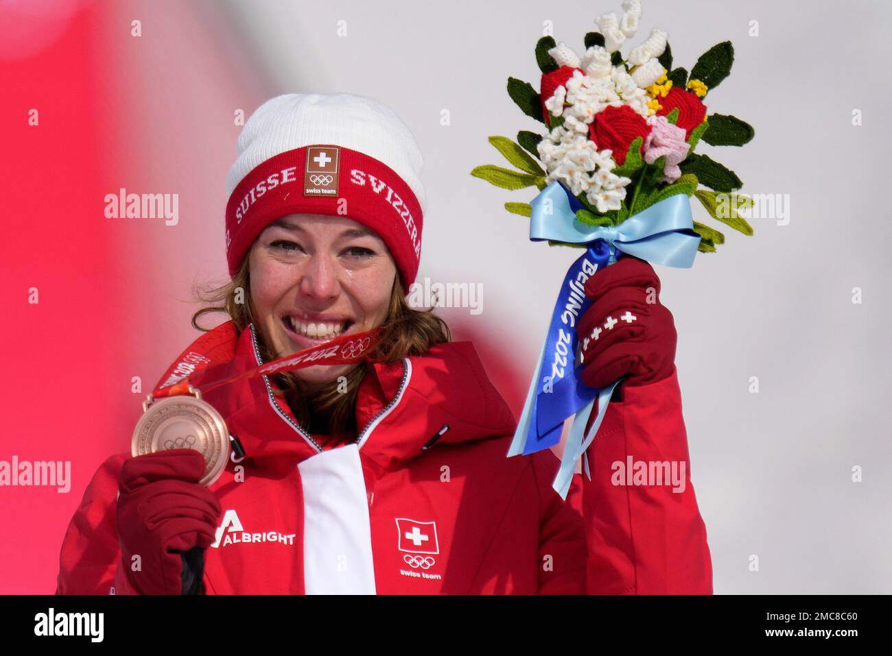 Michelle Gisin, of Switzerland, reacts during the medal ceremony after ...