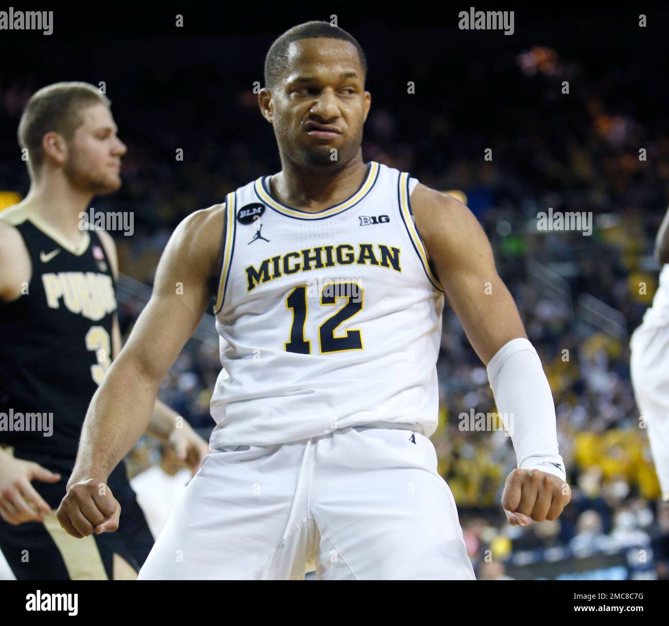 Michigan guard DeVante' Jones (12) celebrates after scoring against the ...