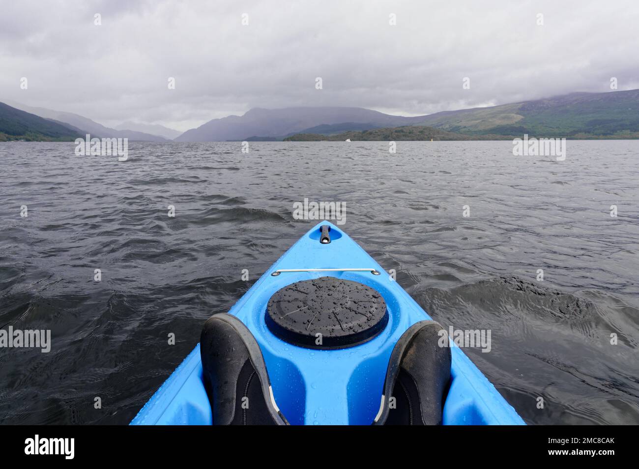 Blue kayak on open water at Loch Lomond Stock Photo - Alamy