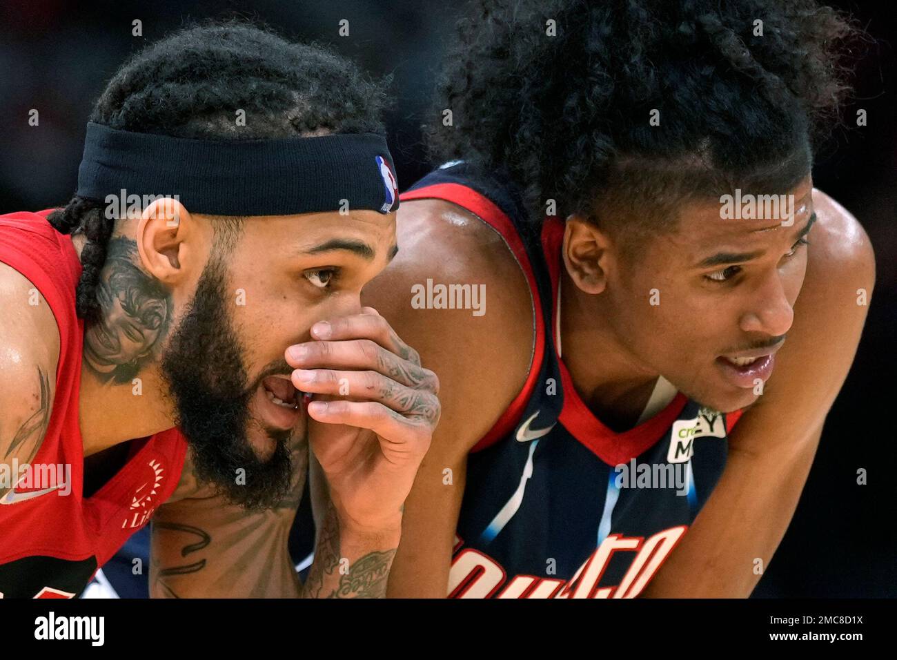 Toronto Raptors guard Gary Trent Jr., left, talks with Houston Rockets ...