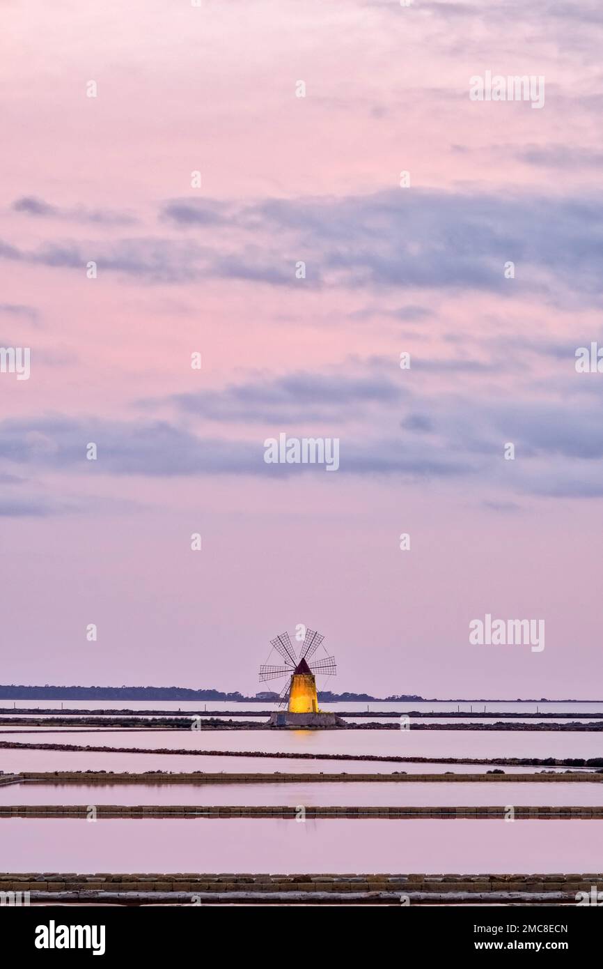 Water basins, salt pans and a windmill at Mozia salt works at sunset ...