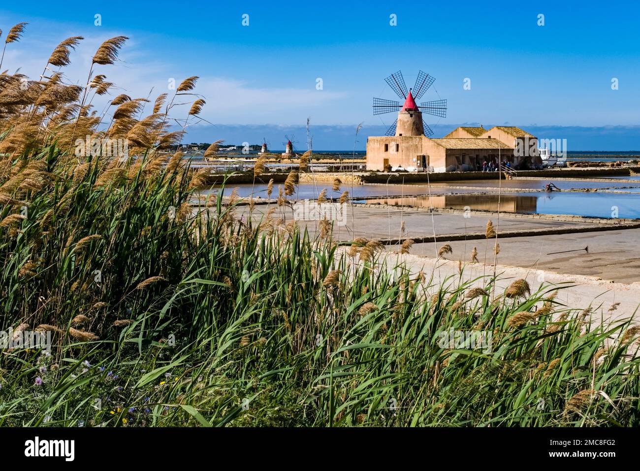 Water basins, salt pans and a windmill at Mozia salt works Stock Photo ...