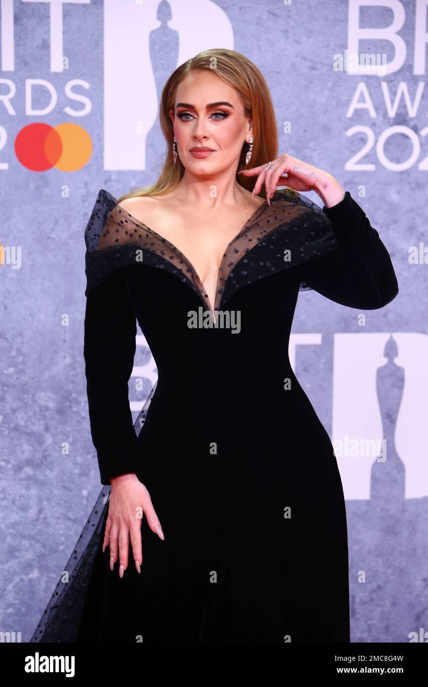 Adele poses for photographers upon arrival at the Brit Awards 2022 in ...