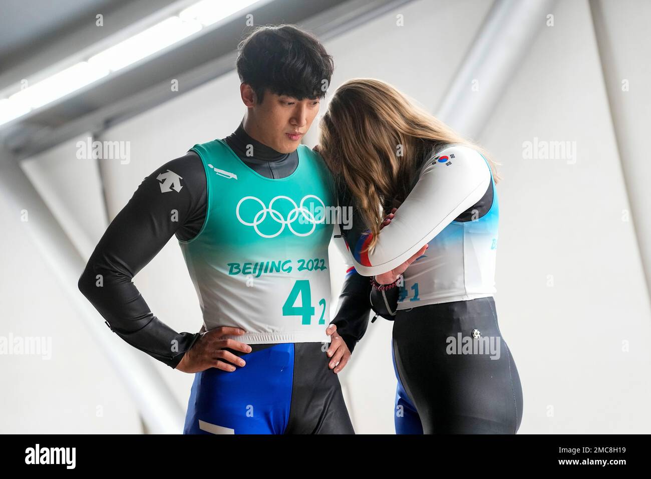 Aileen Frisch, of South Korea, leans on teammate Lim Nam-kyu after the ...
