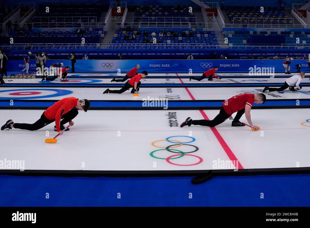 Men's teams warm up before their curling matches, at the 2022 Winter ...
