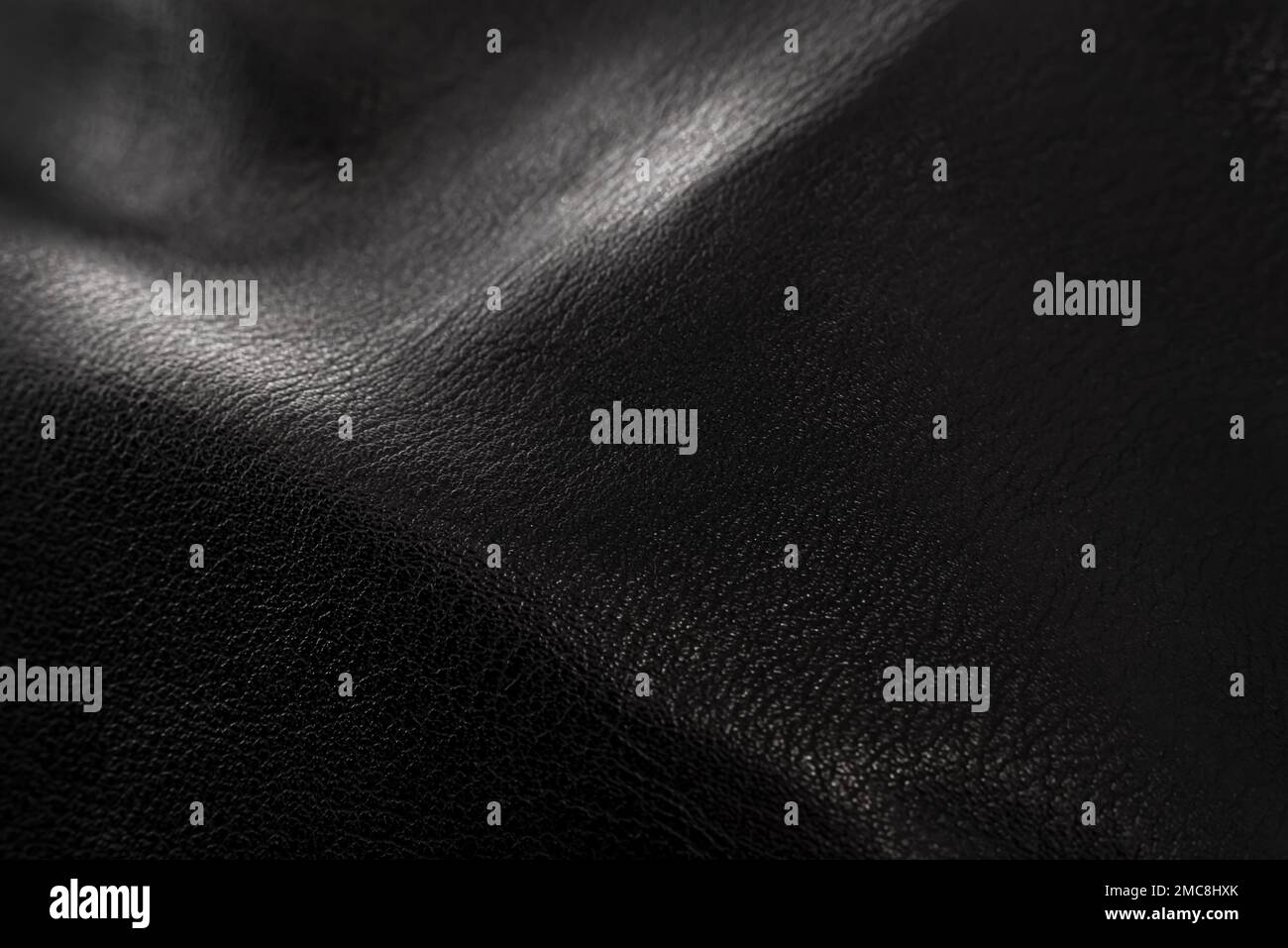 Black leather texture. Abstract background of dark leather with small ...