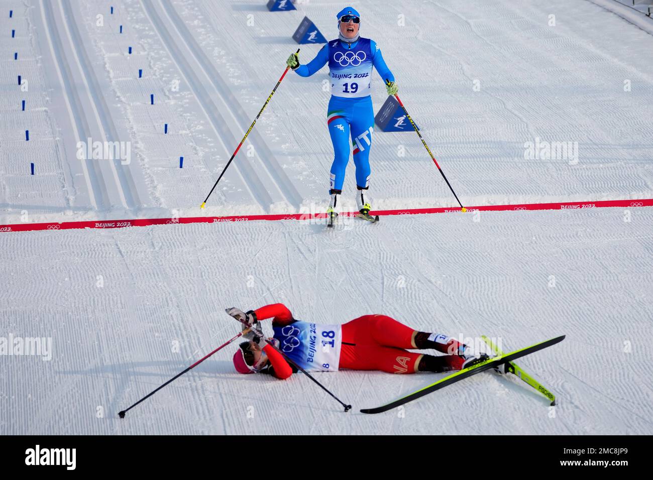 Italy's Anna Comarella reacts as she crosses the finish line during the ...