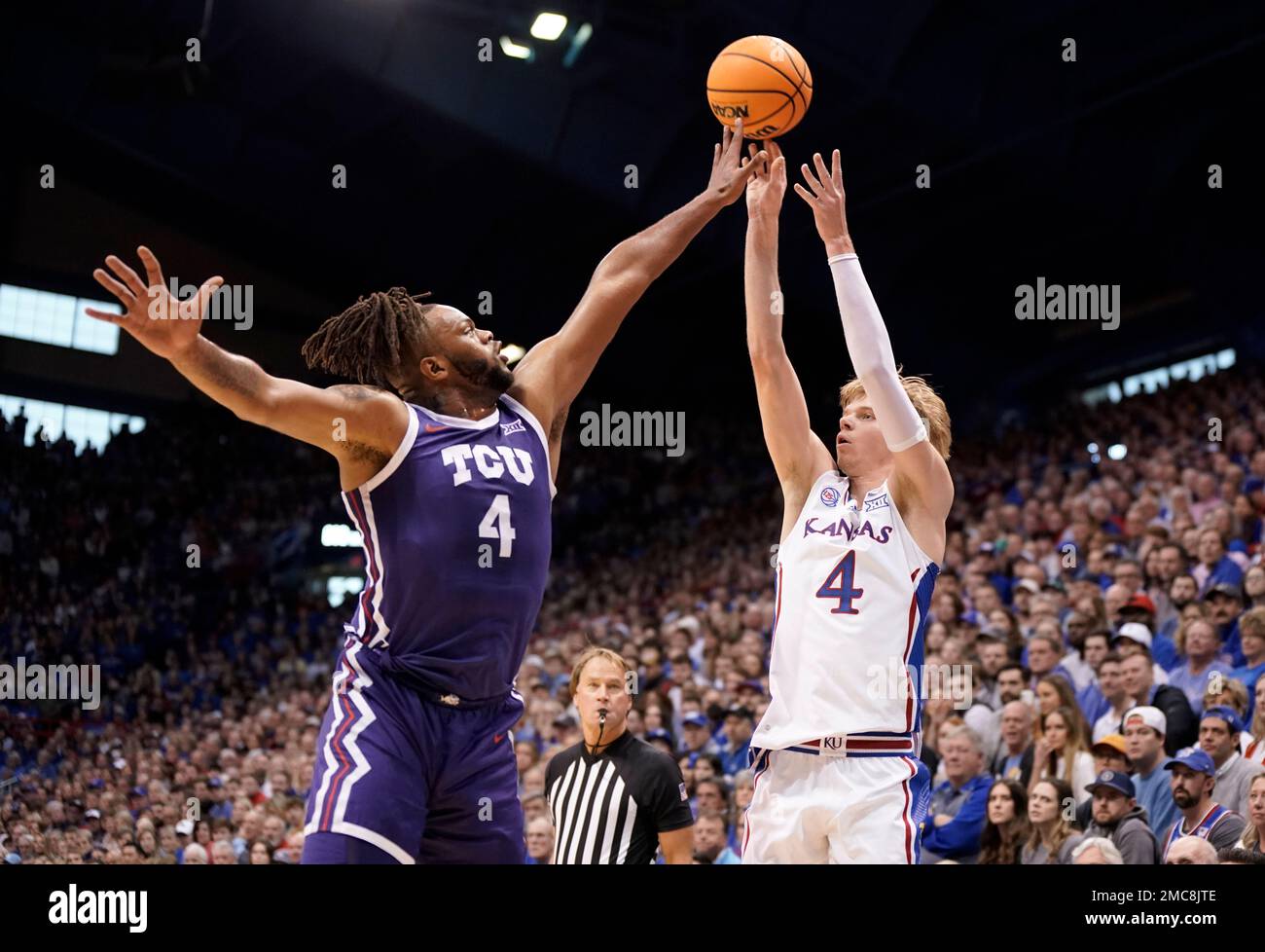 Kansas guard Gradey Dick (4) puts a 3-pointer over TCU center Eddie ...