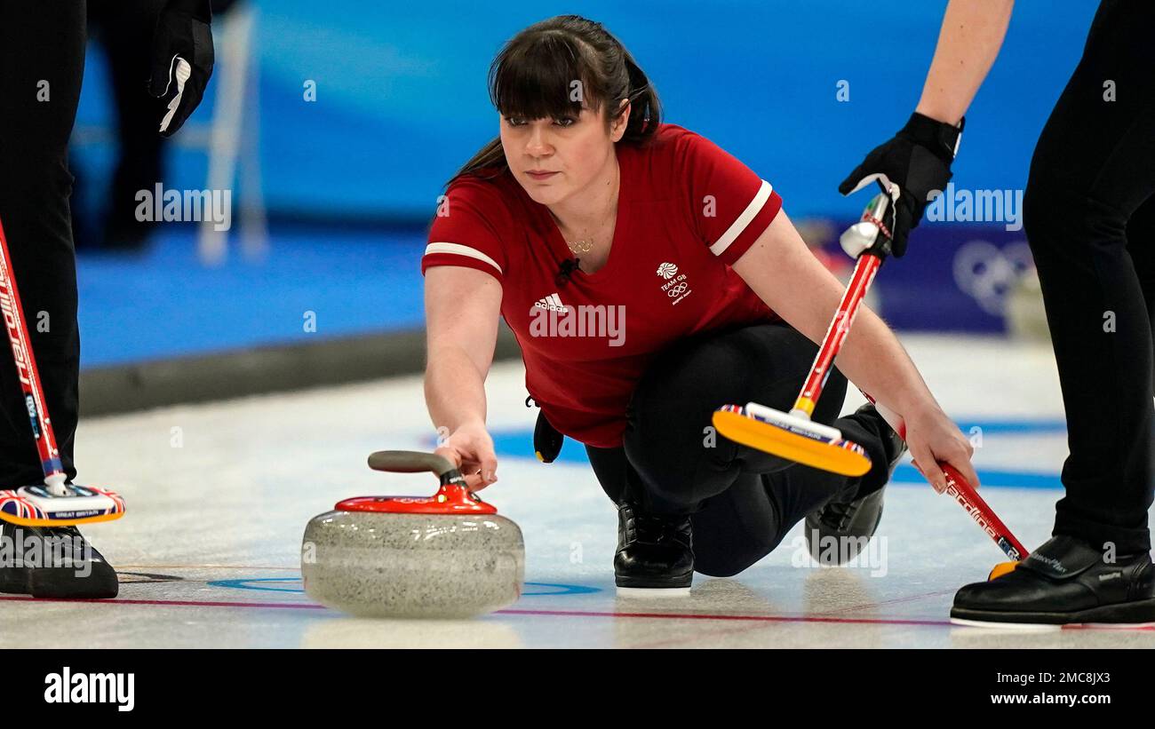 Britain's Hailey Duff throws a rock during a women's curling match ...