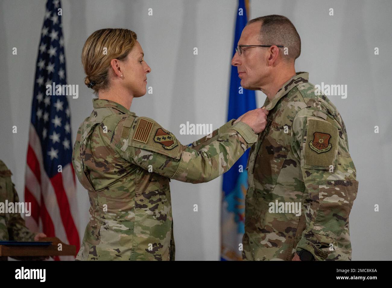 Col. Elizabeth Somsel, 7th Medical Group commander, clips the ...
